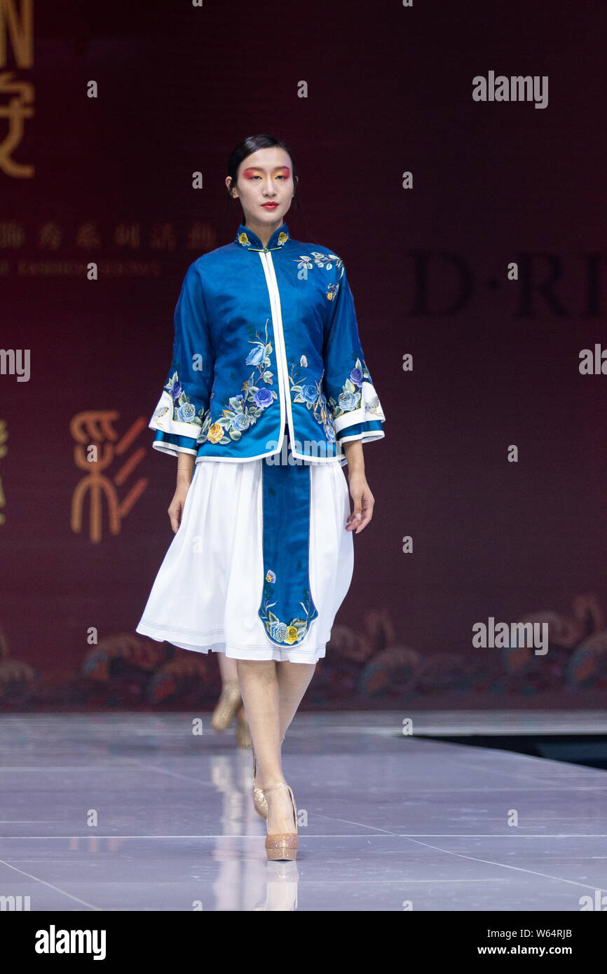 A model displays a traditional new creation during the China Intangible ...