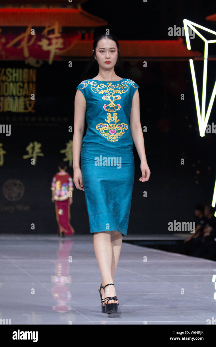 A model displays a traditional new creation during the China Intangible ...