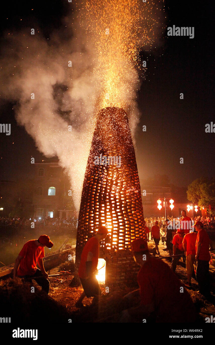 A pagoda made of tile bricks is on fire to mark the Mid-Autumn Festival ...