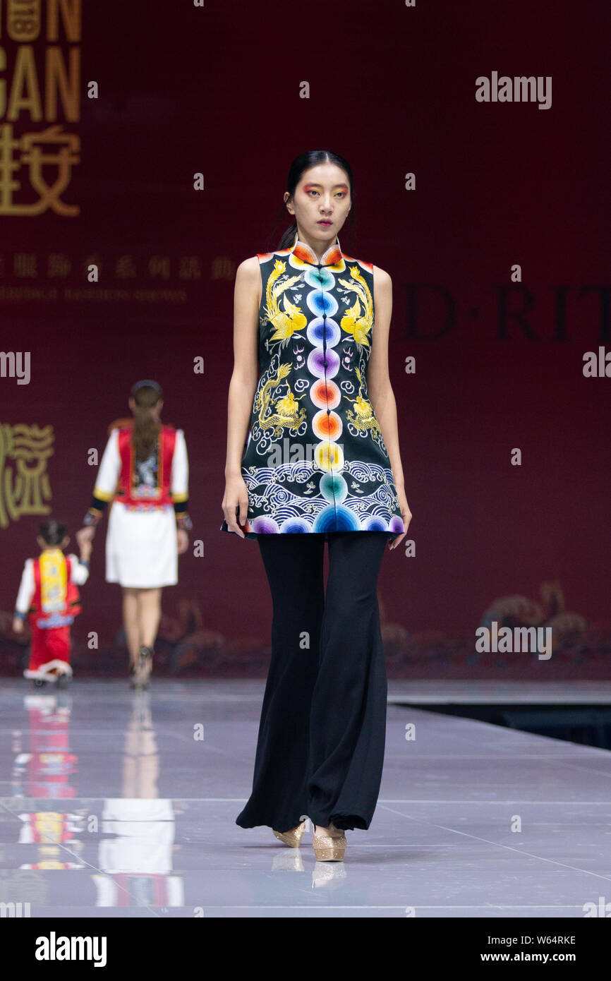 A model displays a traditional new creation during the China Intangible ...