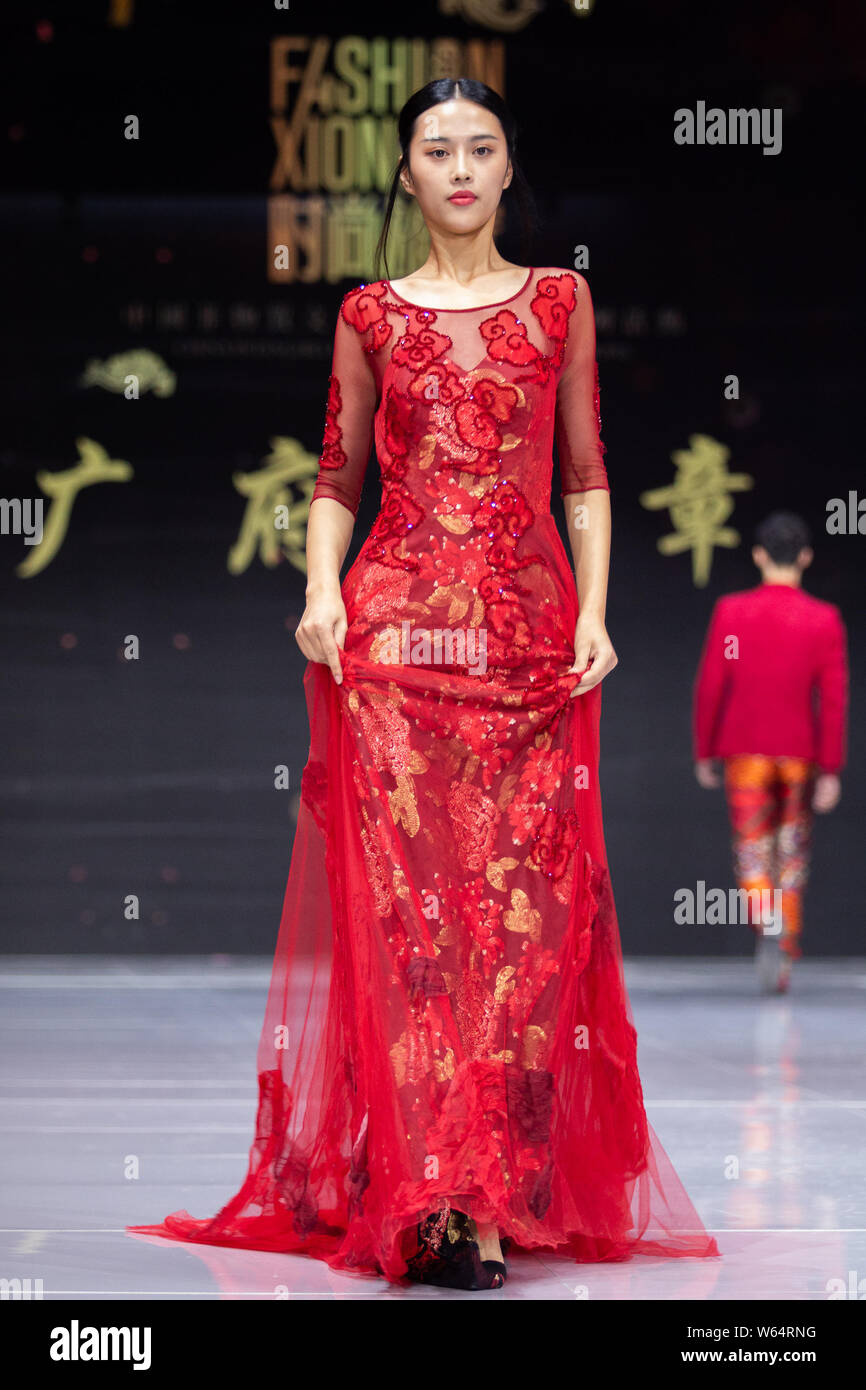 A model displays a traditional new creation during the China Intangible ...