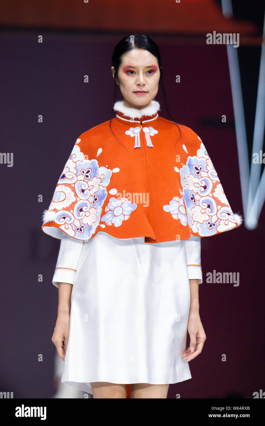 A model displays a traditional new creation during the China Intangible ...