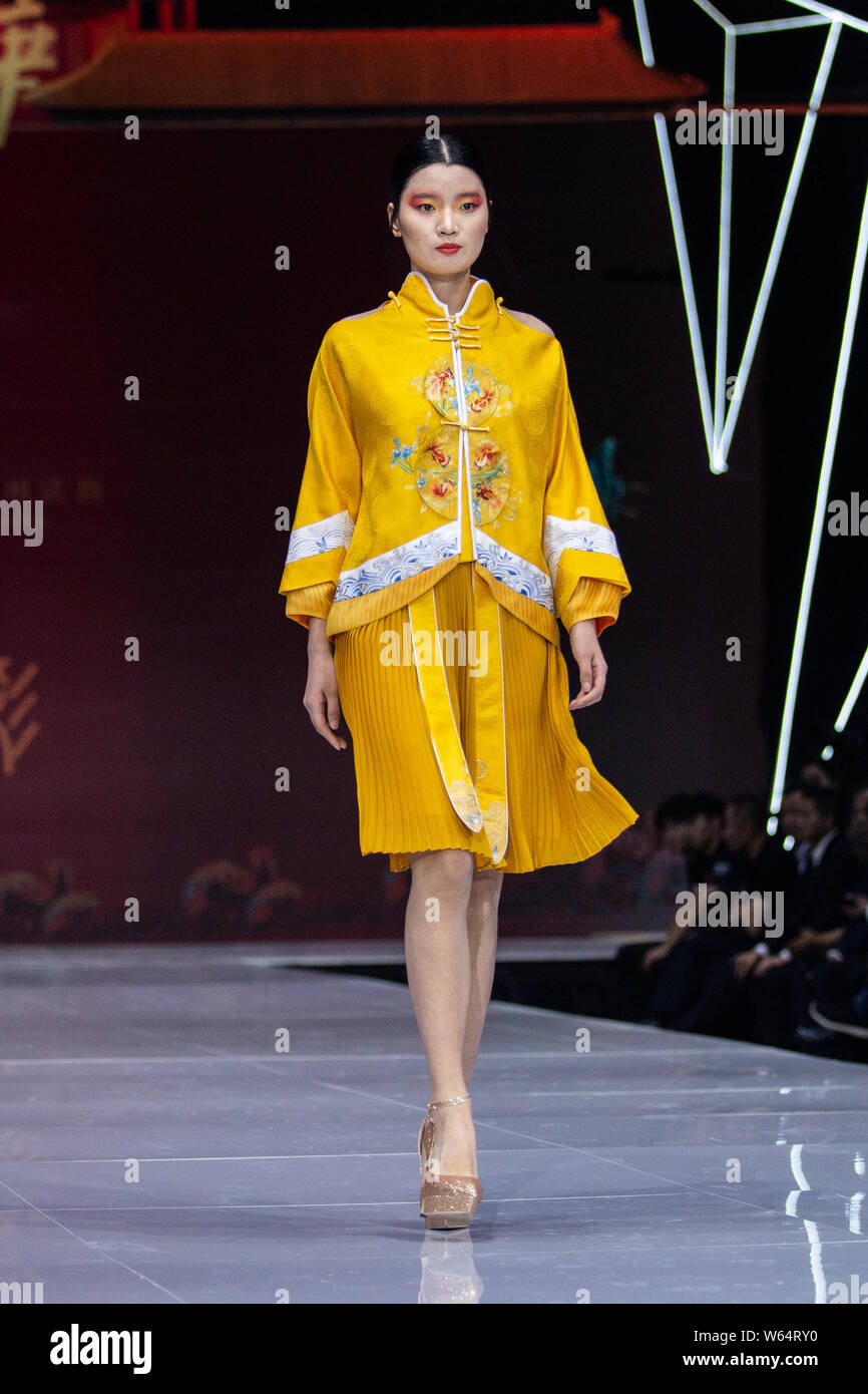 A model displays a traditional new creation during the China Intangible ...