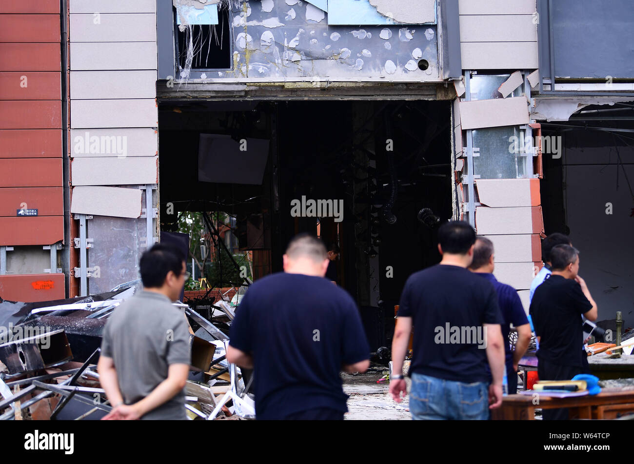 Local residents gather at the accident site after a liquefied gas ...