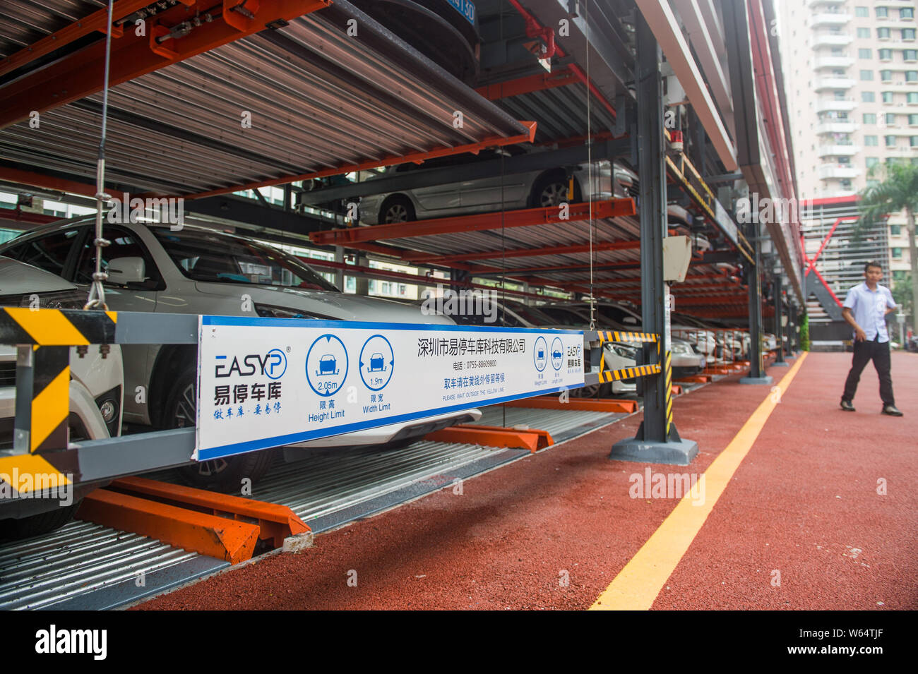 Cars are parked in a newly-built smart parking lot near the Tianan ...