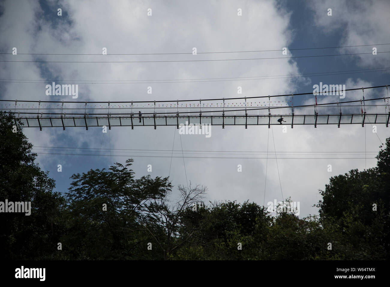 An aerial view of the 5D glass-bottom bridge over the Qinglong Valley ...