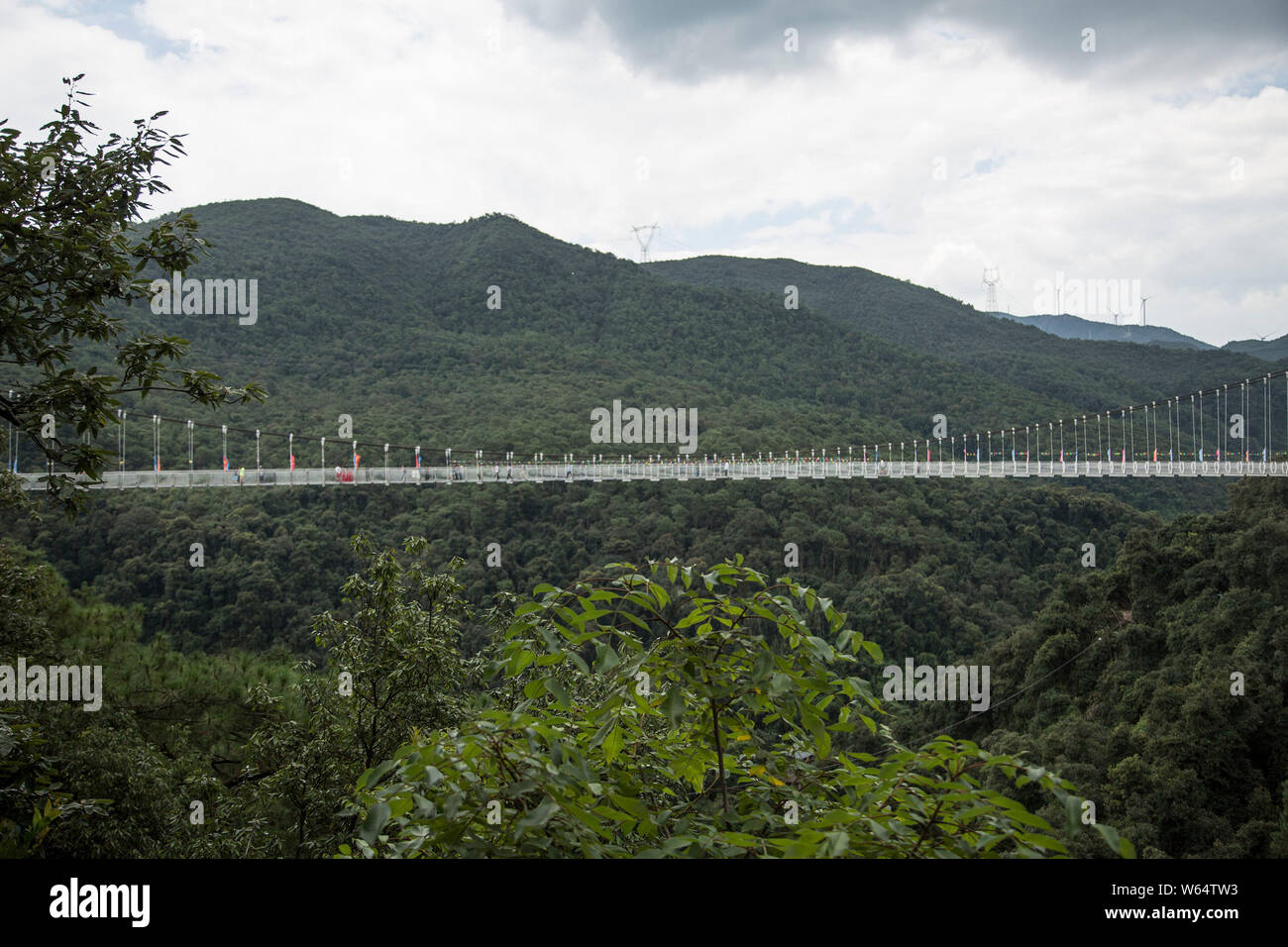 An aerial view of the 5D glass-bottom bridge over the Qinglong Valley ...