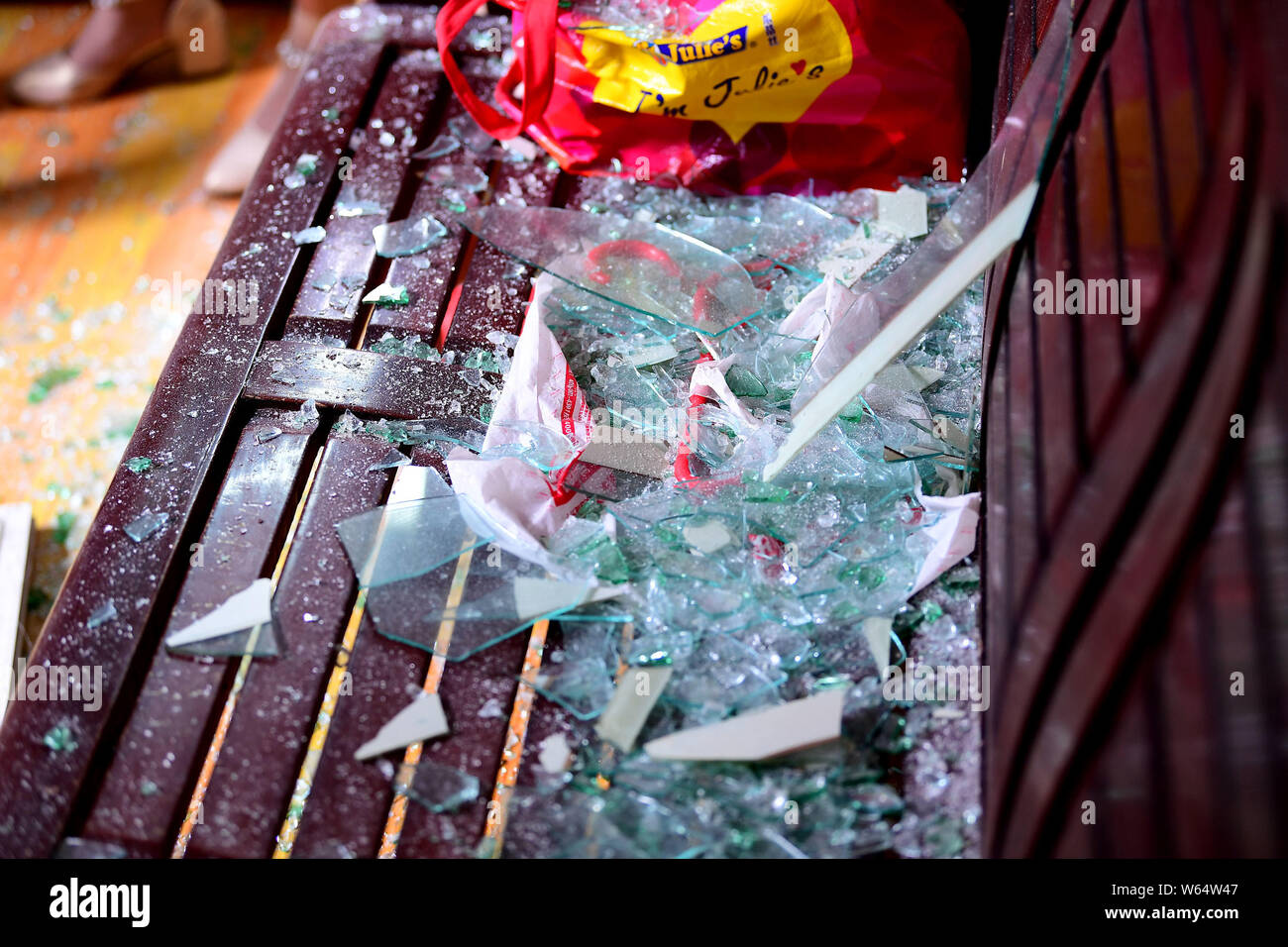A window is broken after a liquefied gas container exploded, killing ...