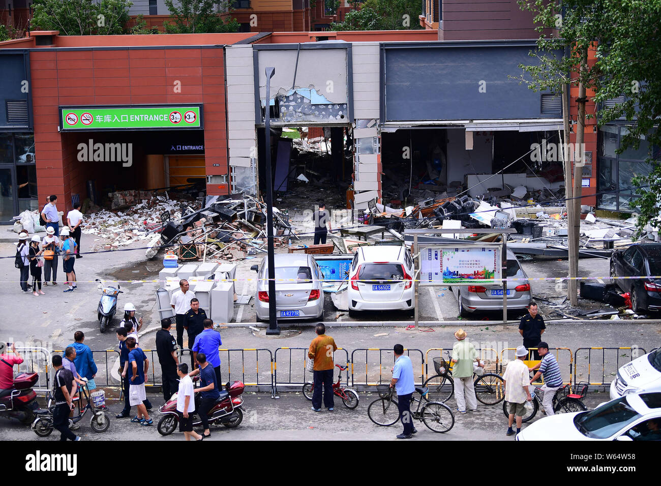 Local residents gather at the accident site after a liquefied gas ...