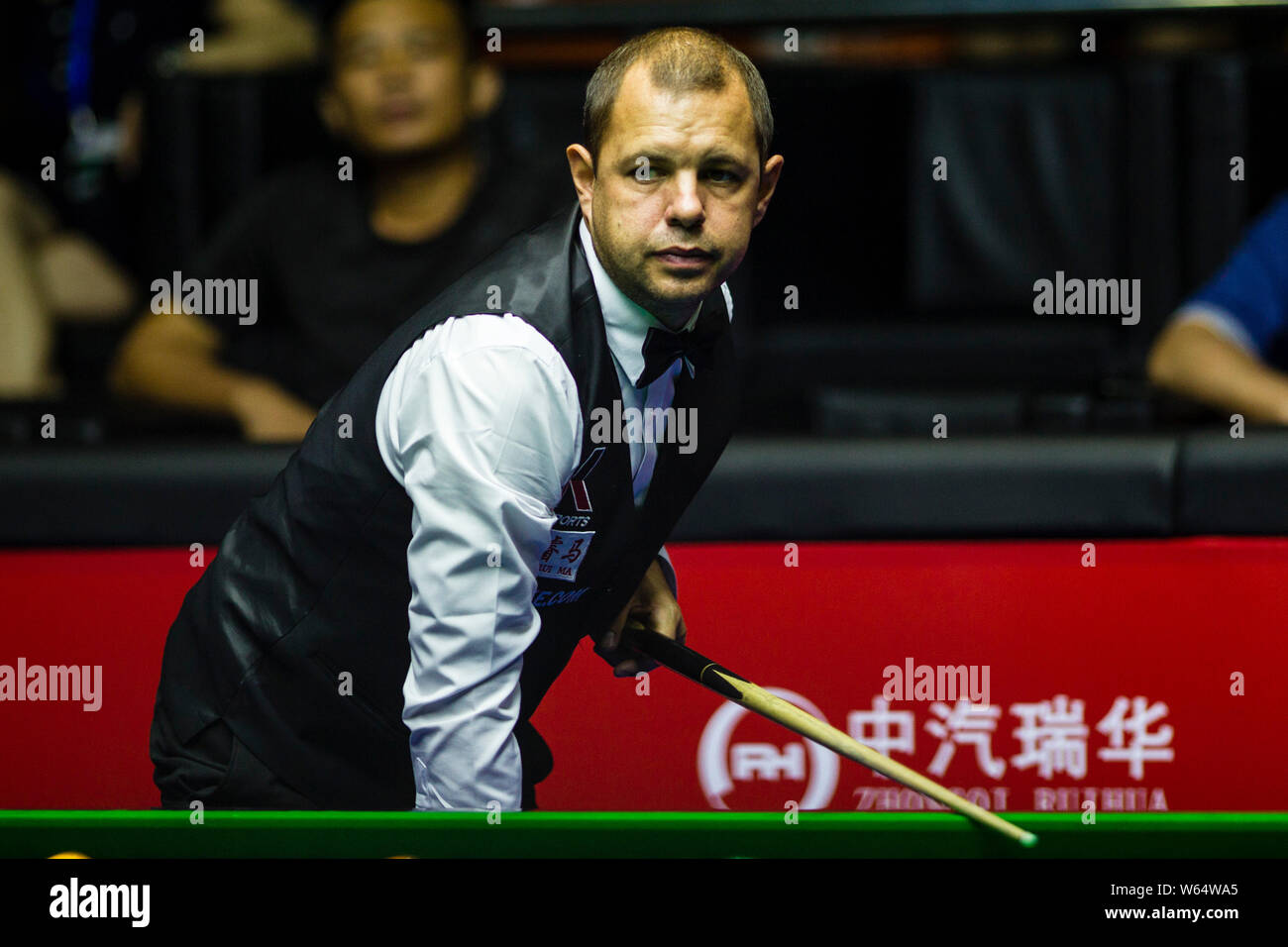 Barry Hawkins of England considers a shot to David Gilbert of England ...