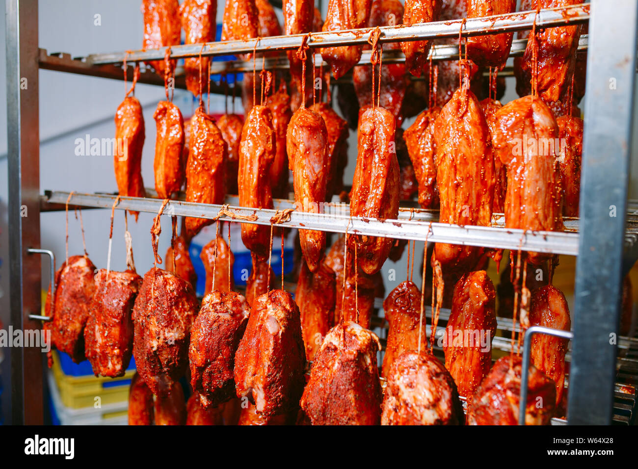 Smoked ham in the oven. Sausage production in the factory Stock Photo ...