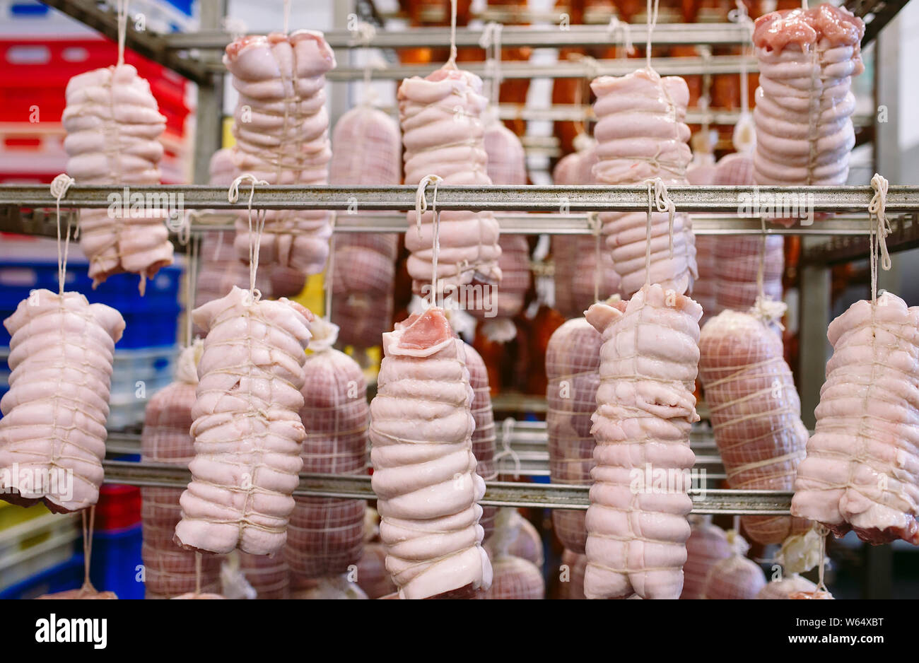 Smoked ham in the oven. Sausage production in the factory Stock Photo ...