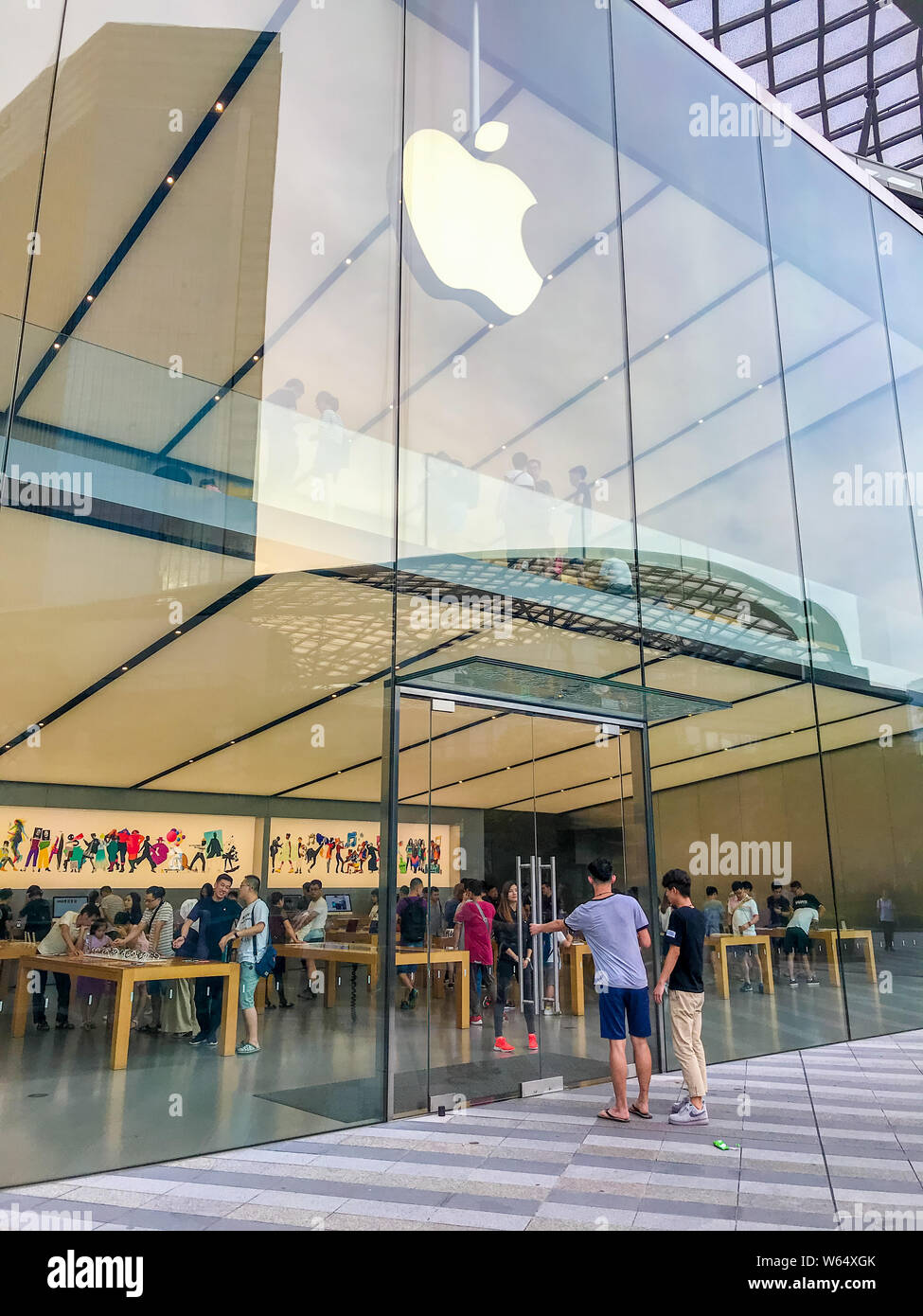 The first customers enter apple store hi-res stock photography and ...