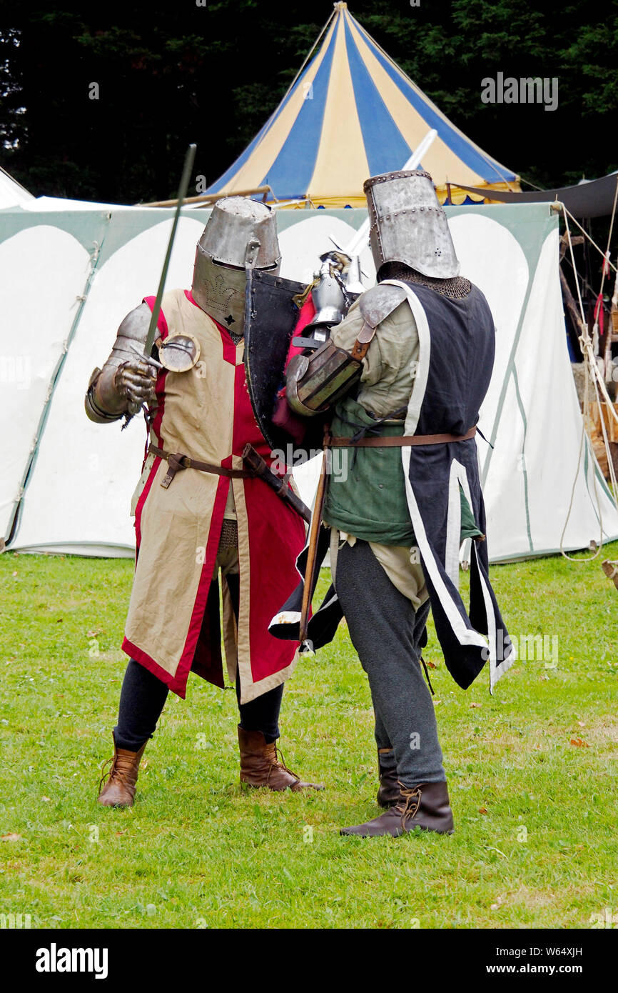 Military re-enactors demonstrate the armour and one on one sword ...