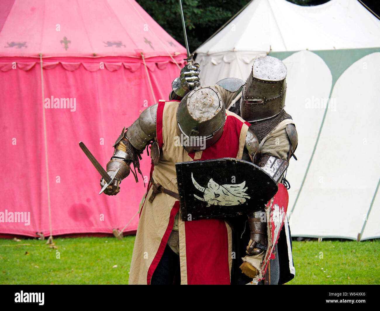 Military re-enactors demonstrate the armour and one on one sword ...