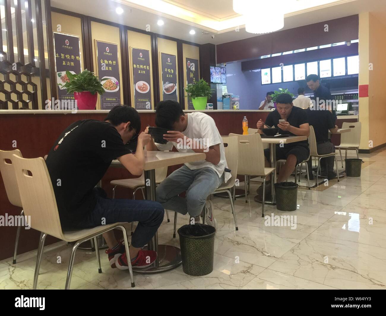 Diners are seen at the head branch of a chain noodle shop that sells ...