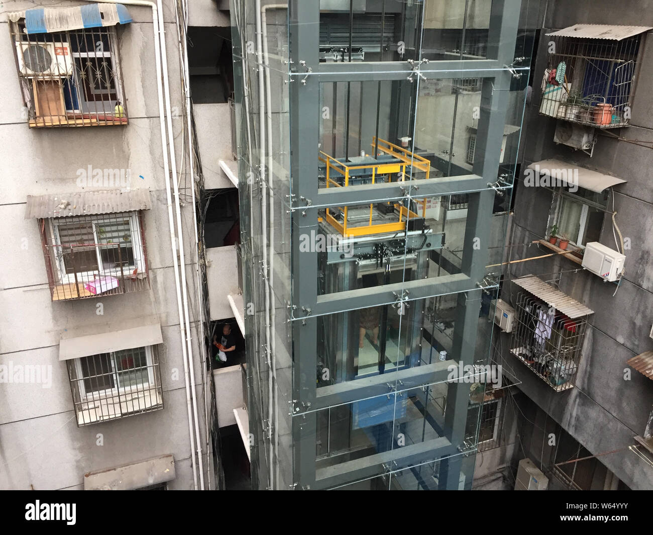 View of the sightseeing elevator built by 136 households on the facade ...