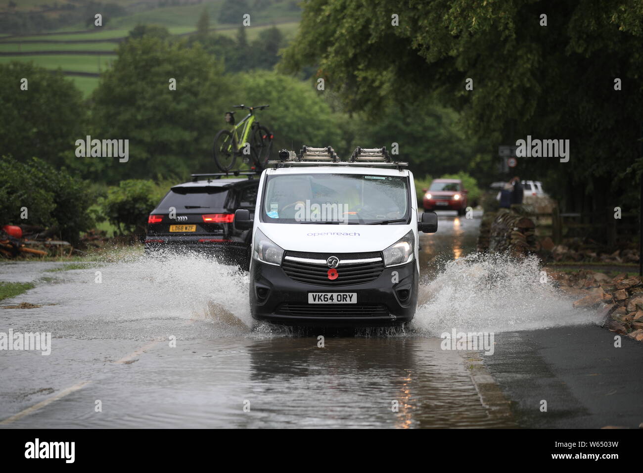A van being driven through flood water in Yorkshire, after parts of the ...