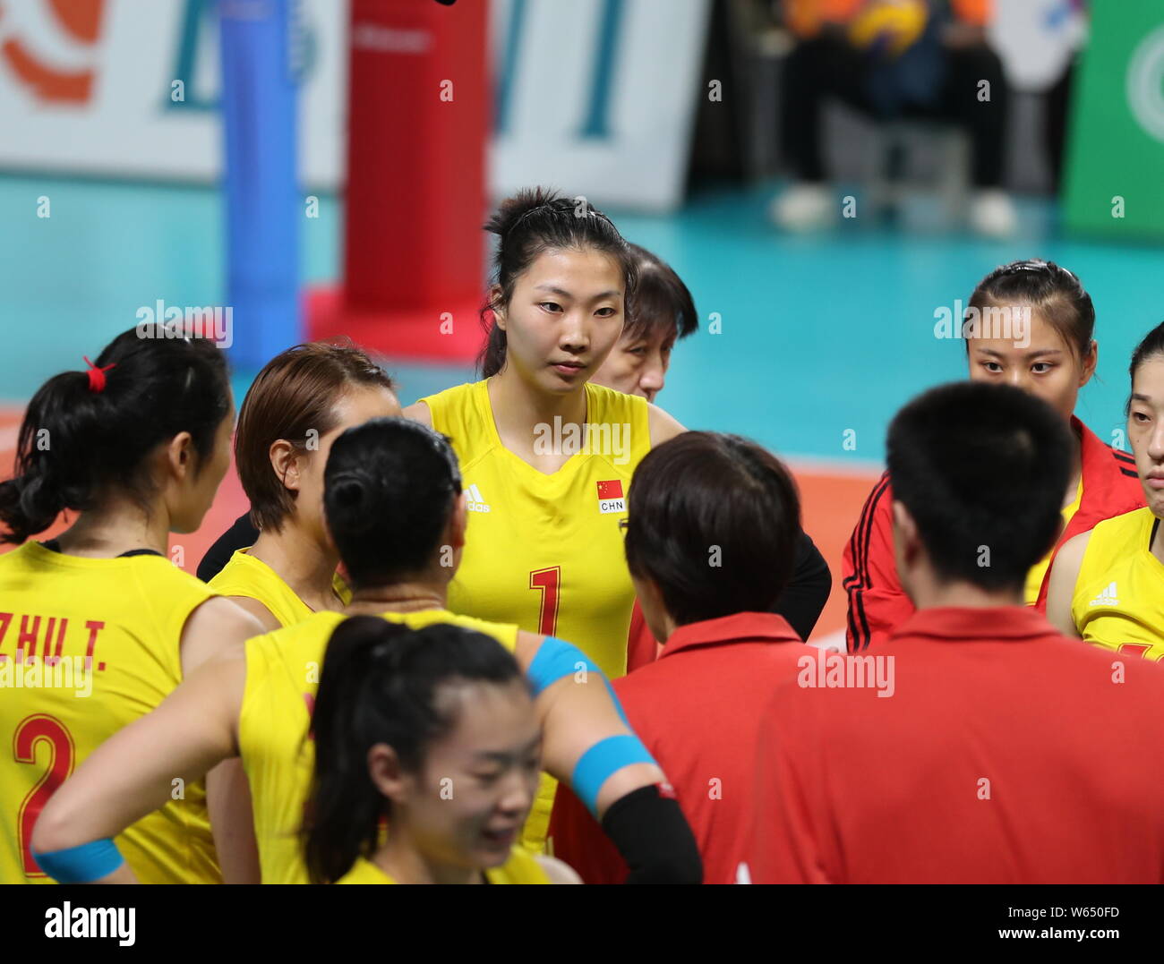 Yuan Xinyue of China, tallest, listens to head coach Lang Ping as they ...