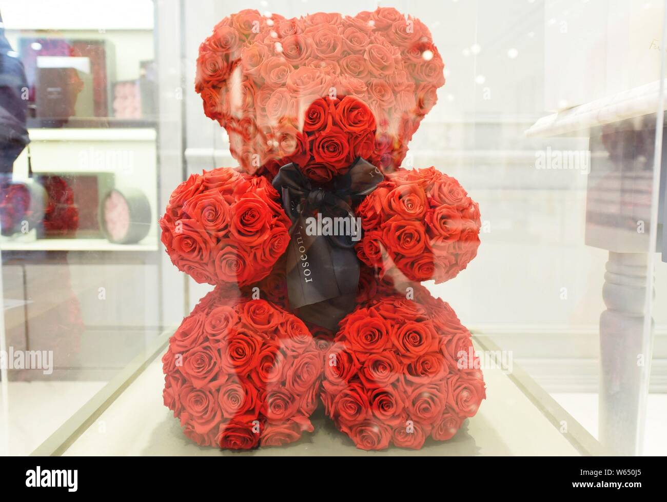Winnie the Pooh made of 400 red roses is on display at a shopping mall ...