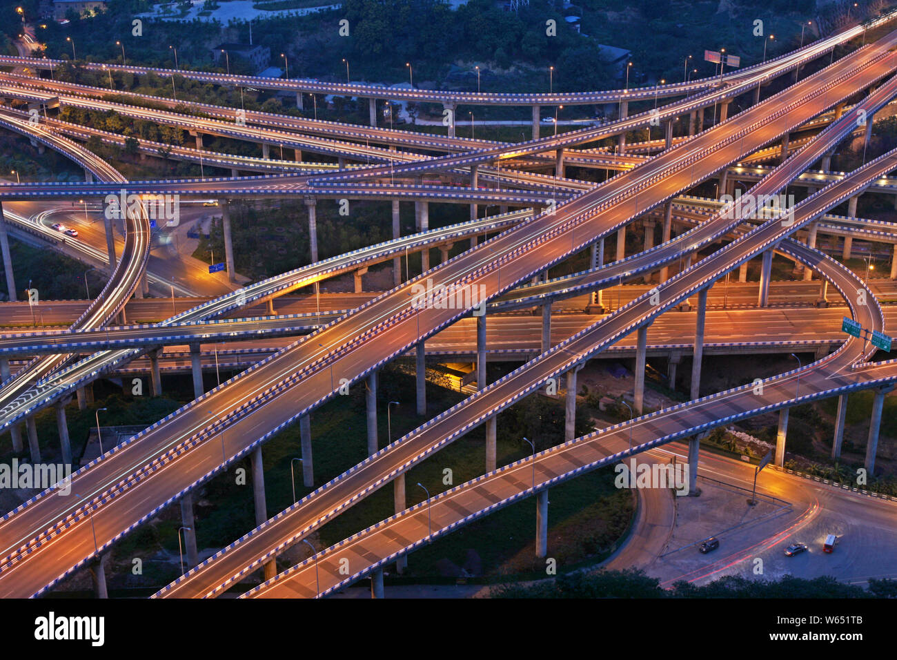 In this aerial view, cars drive on the five-level Huangjuewan overpass ...
