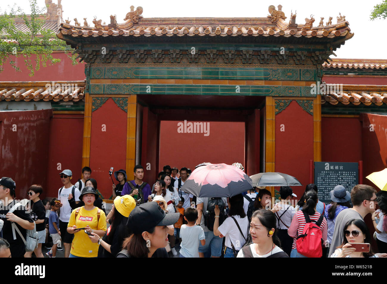 Tourists visit the Yanxi Palace, also known as the Palace of Prolonging ...
