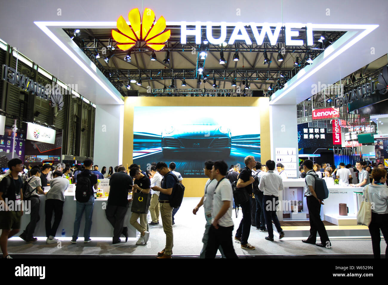 --FILE--People visit the stand of Huawei during an expo in Shanghai ...