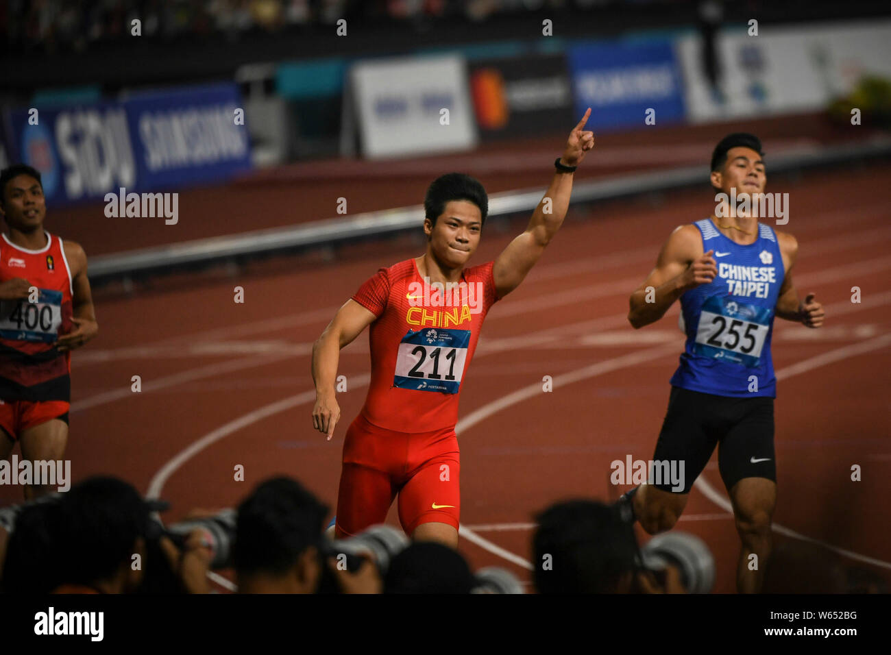 Su Bingtian of China celebrates after winning the men's 100m final of ...
