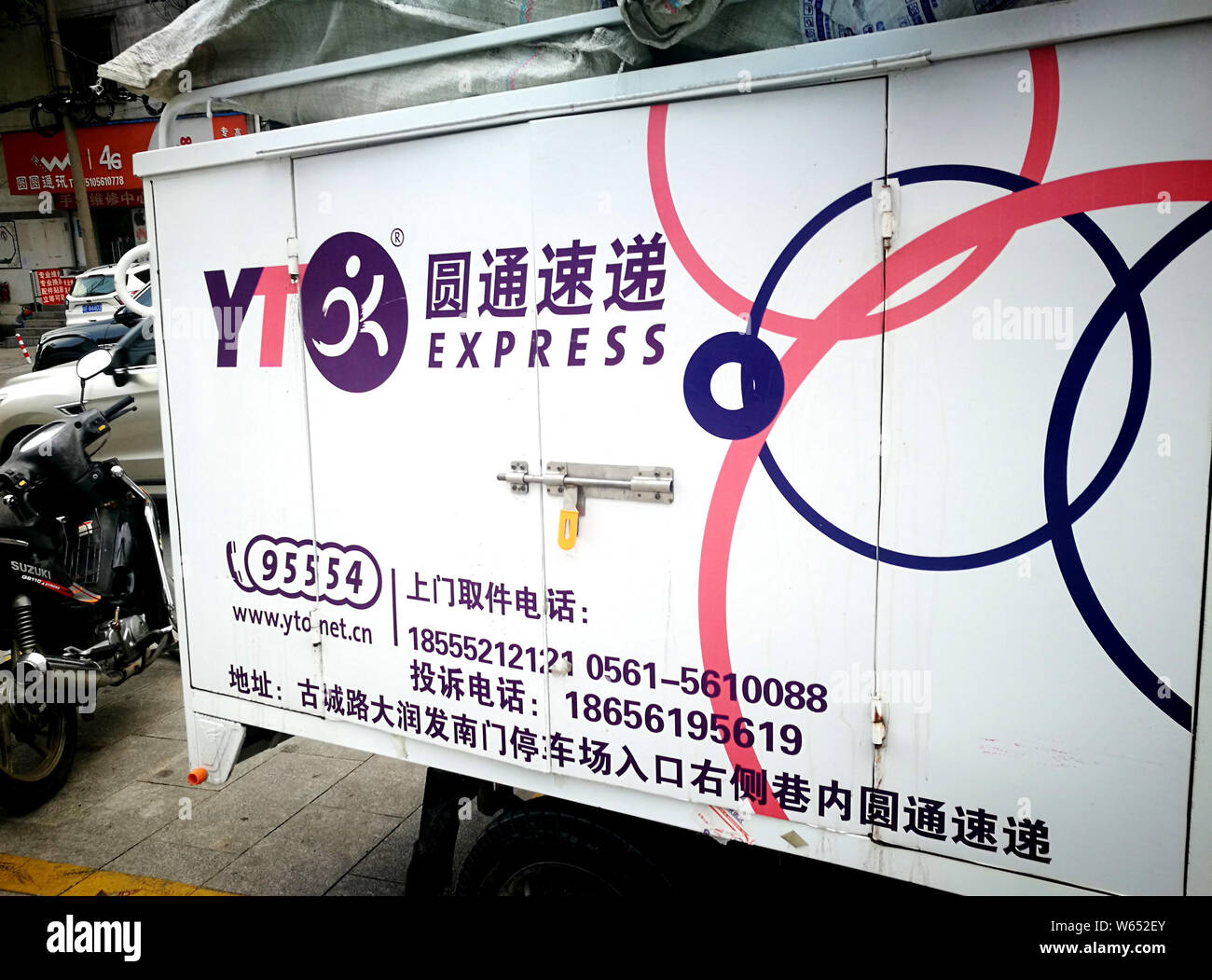 --FILE--A delivery vehicle of YTO Express is parked on a road in ...