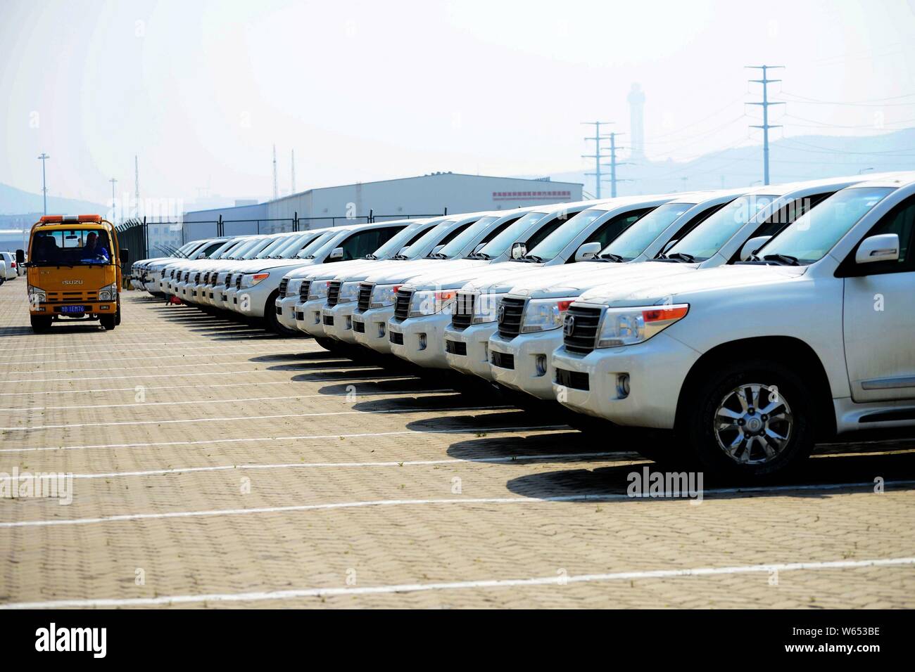 --FILE--Chinese customs officers check imported cars on a quay at the ...