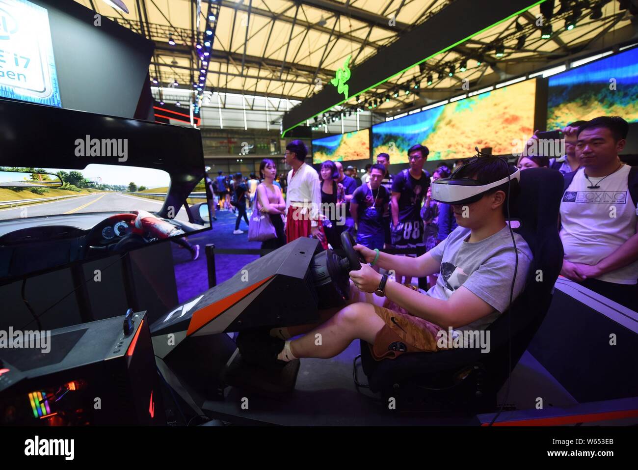 A Chinese visitor tries out a VR console during the 16th China Digital ...