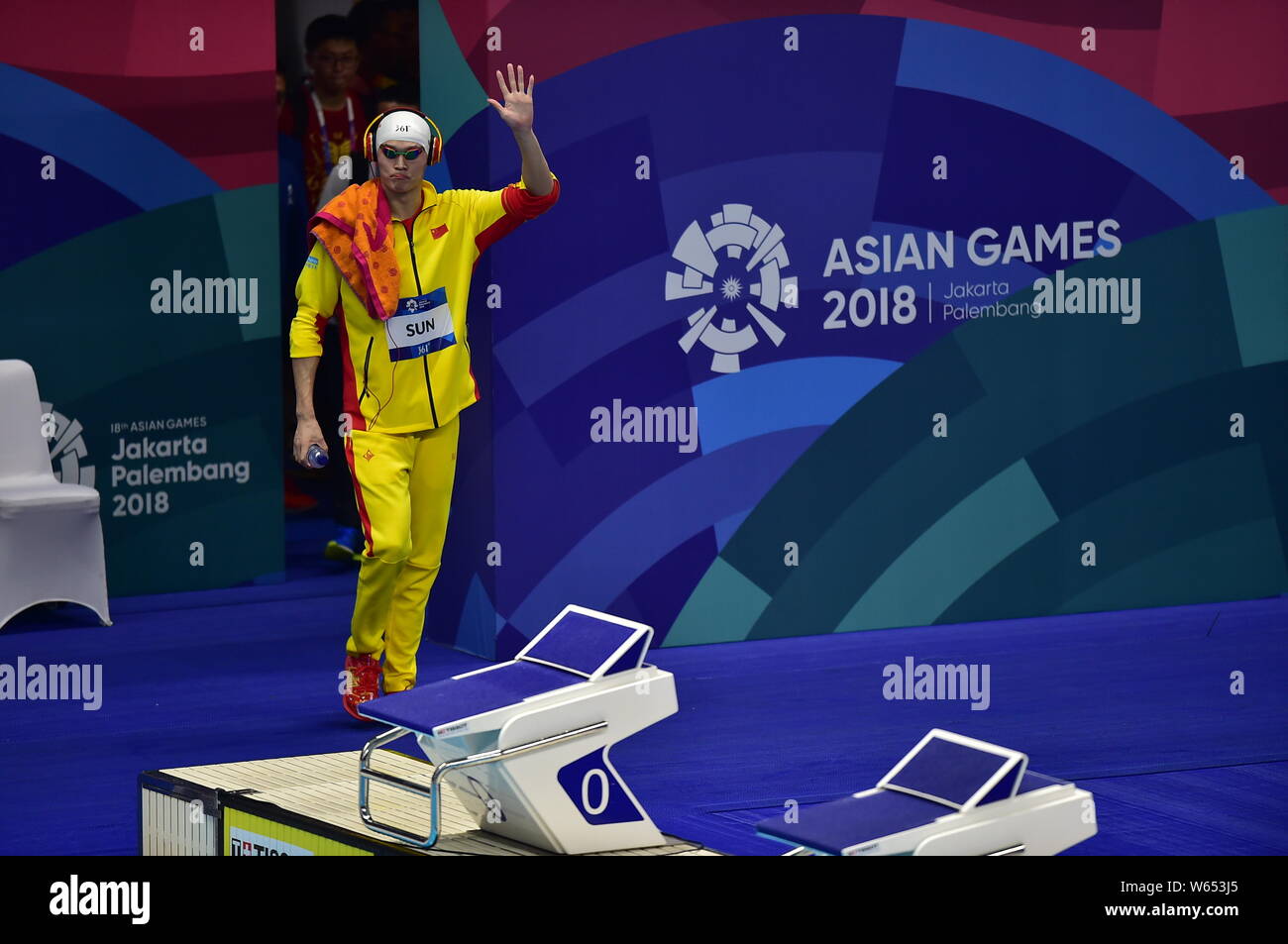 Sun Yang of China waves in the men's 200m freestyle final during the ...