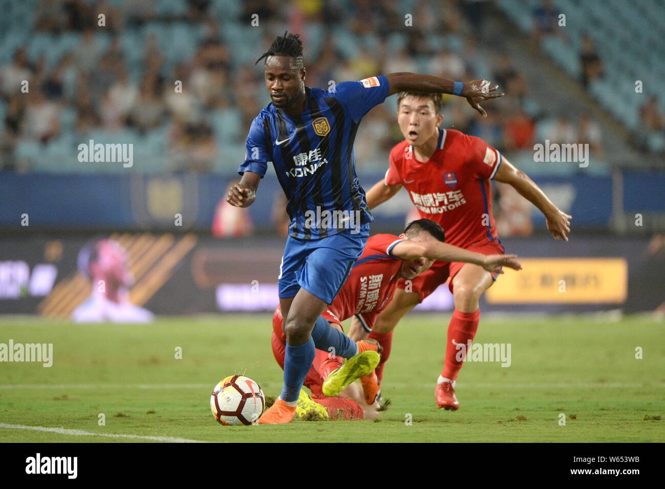 Ghanaian football player Richmond Boakye of Jiangsu Suning dribbles ...