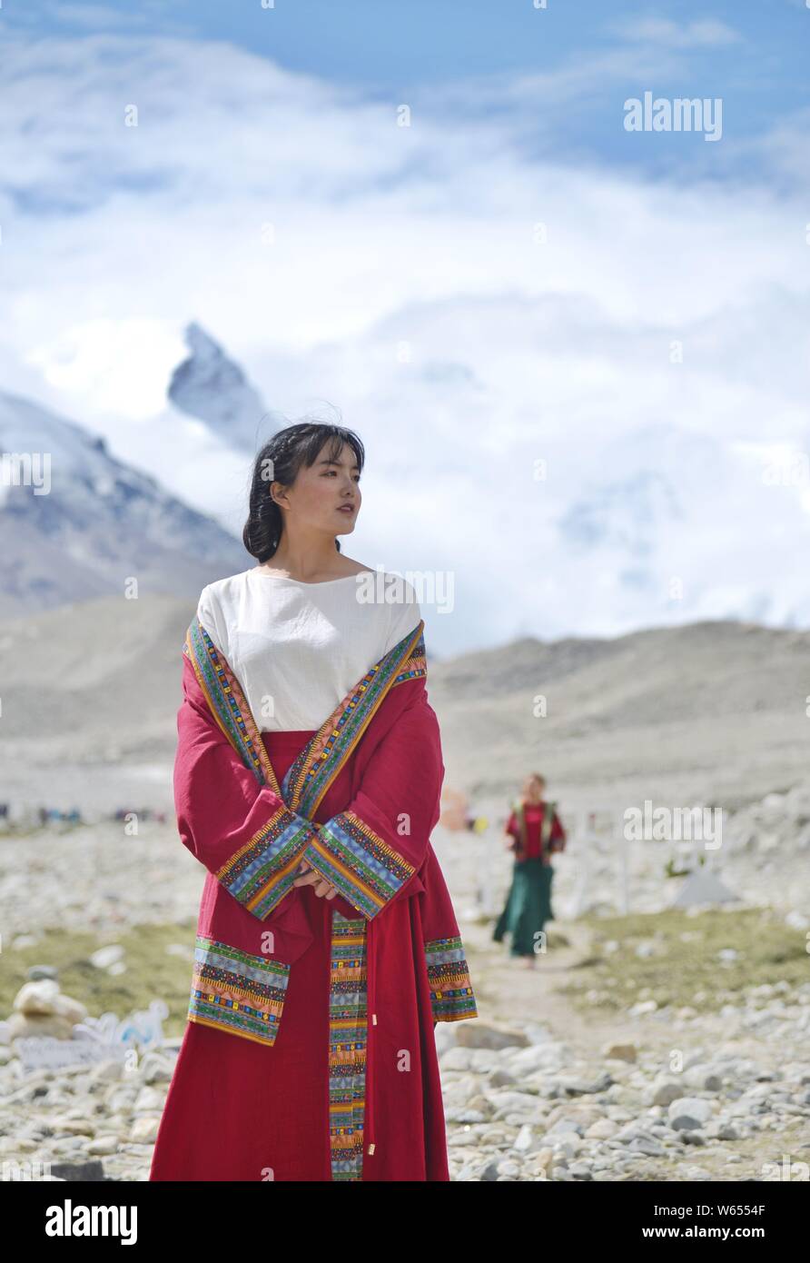 A model presents a new creation of traditional Tibetan costume during a ...