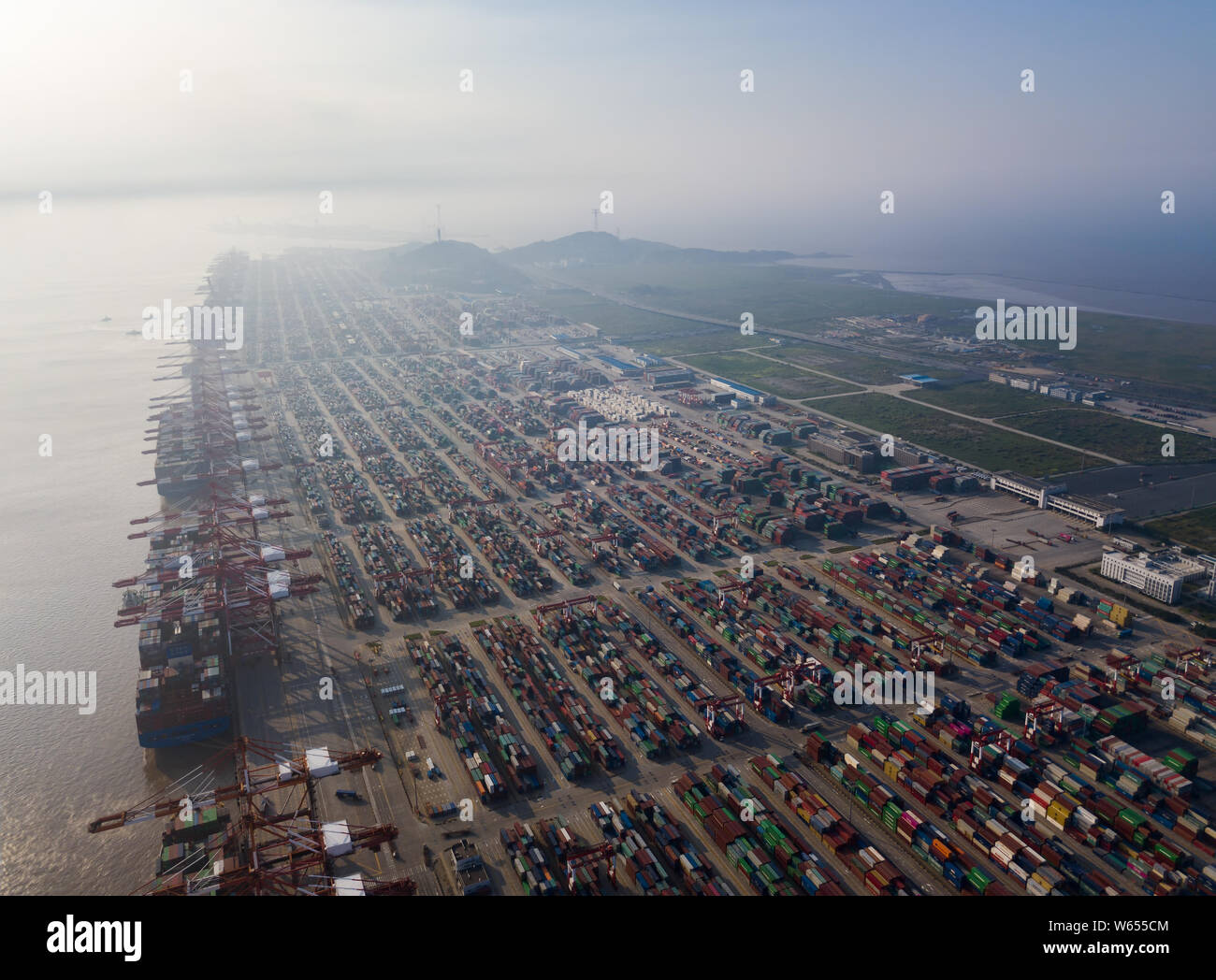 An aerial view of stacks of containers at the Yangshan Deep-Water Port ...