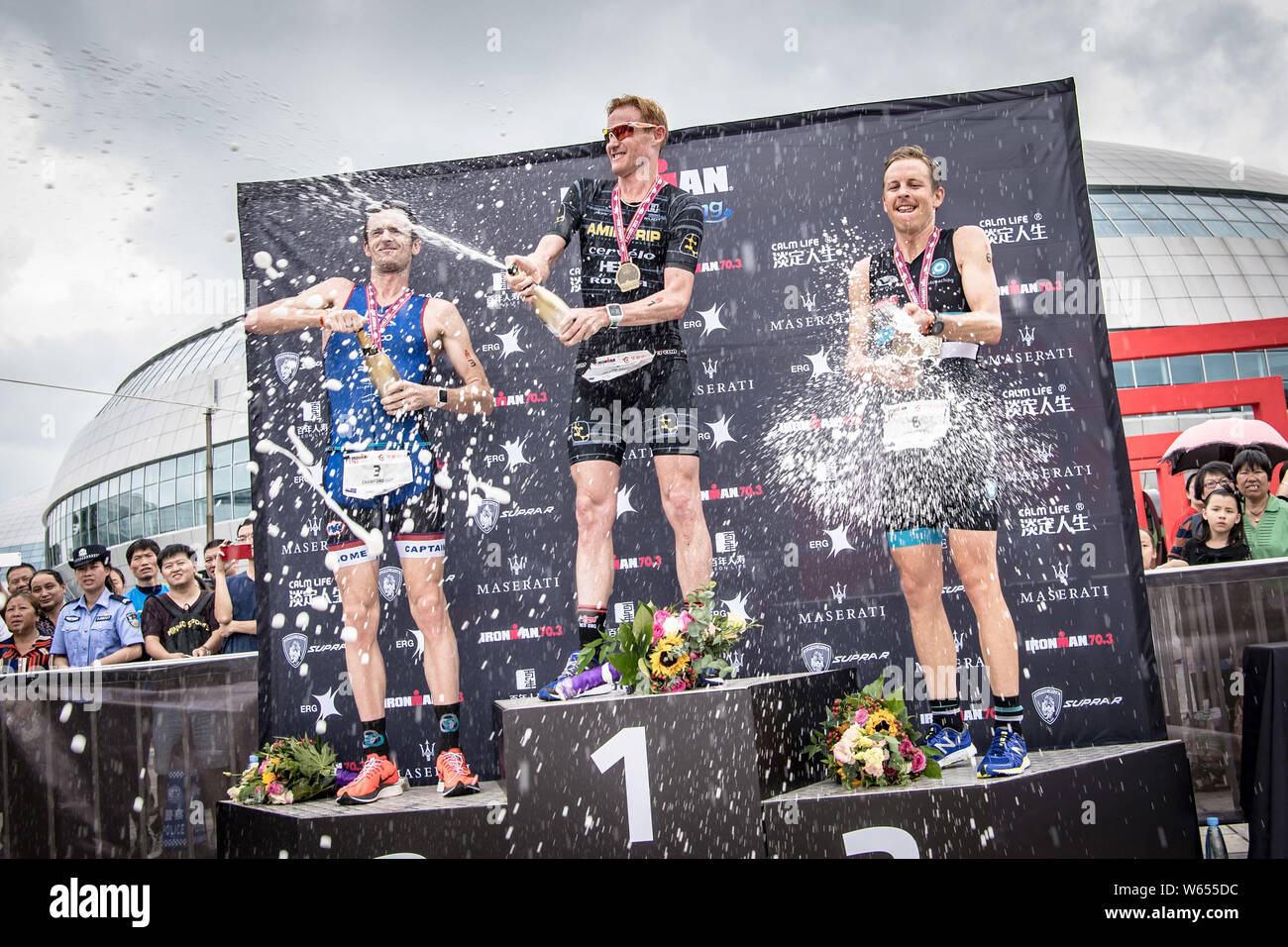 (From left) First runner-up Guy Crawford of New Zealand, winner David ...