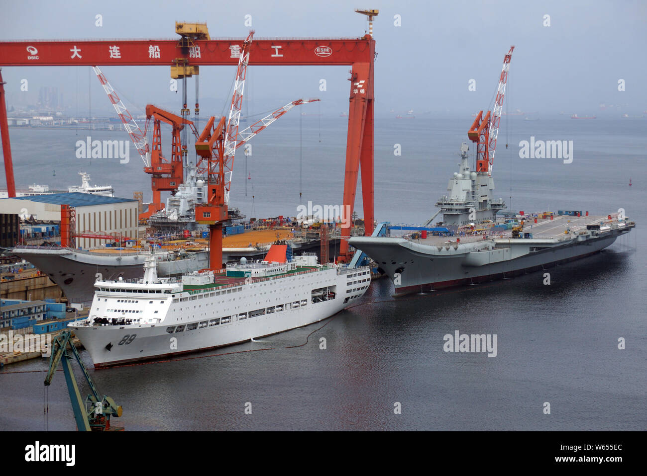 China's first domestically built aircraft carrier, right, the Type 001A ...