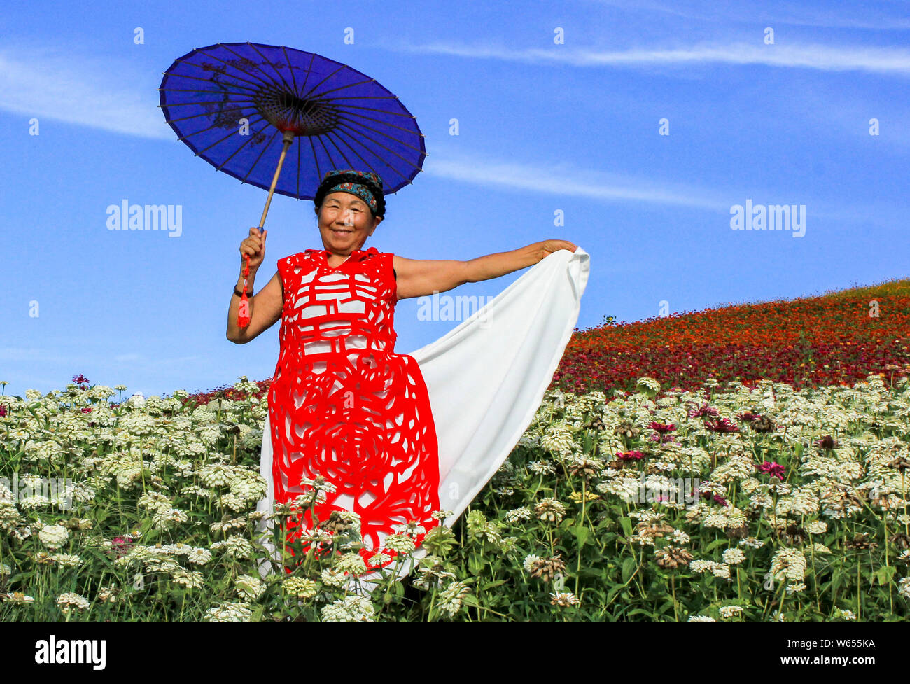 75-year-old Chinese elderly woman Zhang Guiying shows a cheongsam ...