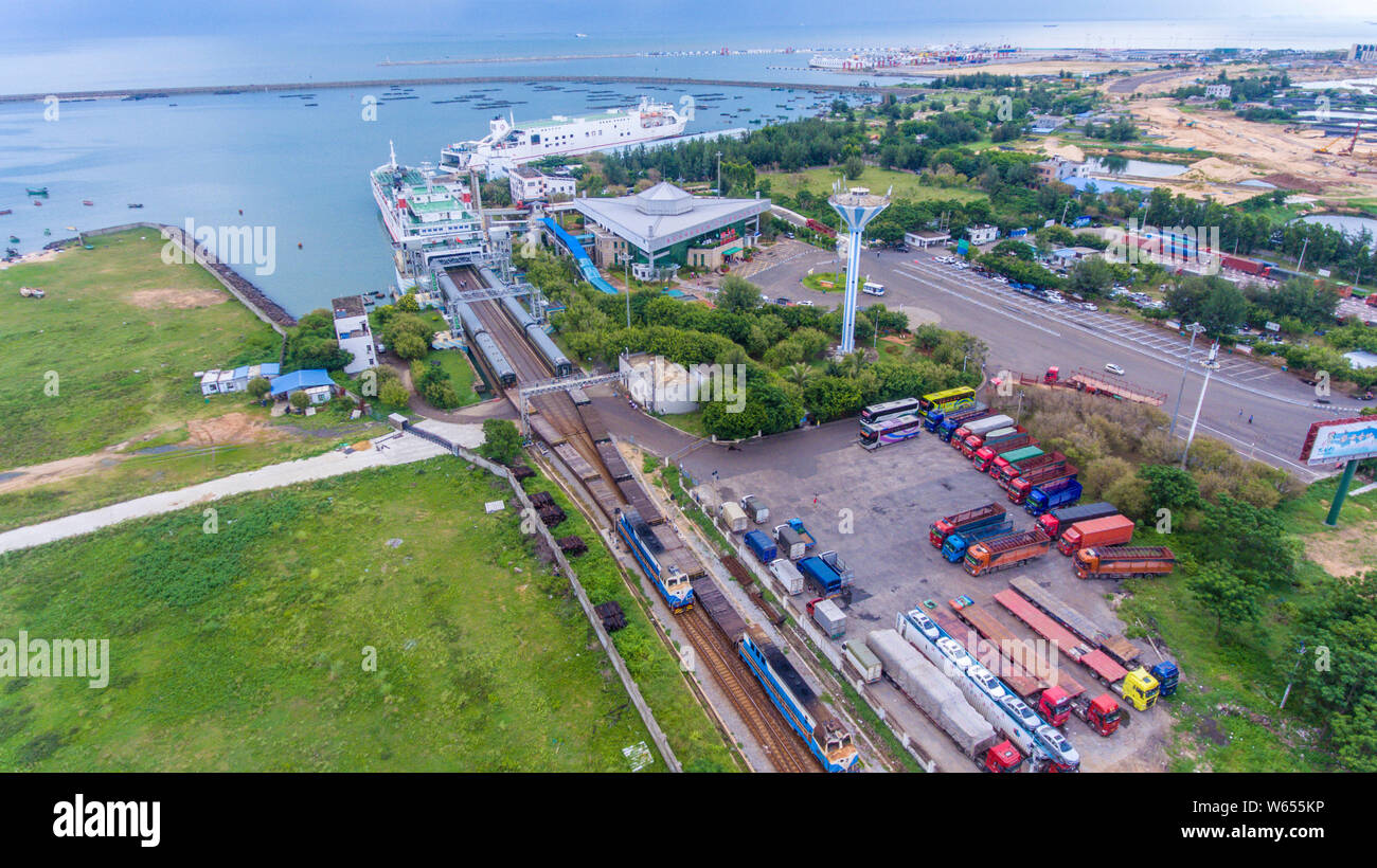 --FILE--Passenger trains runs to disembark from a ferry at the Nangang ...