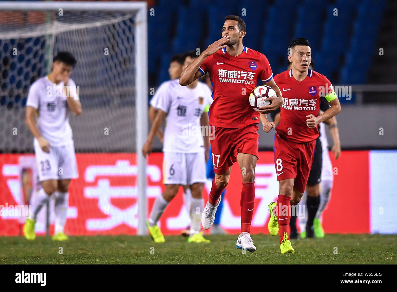 Brazilian football player Alan Kardec of Chongqing SWM celebrates after ...