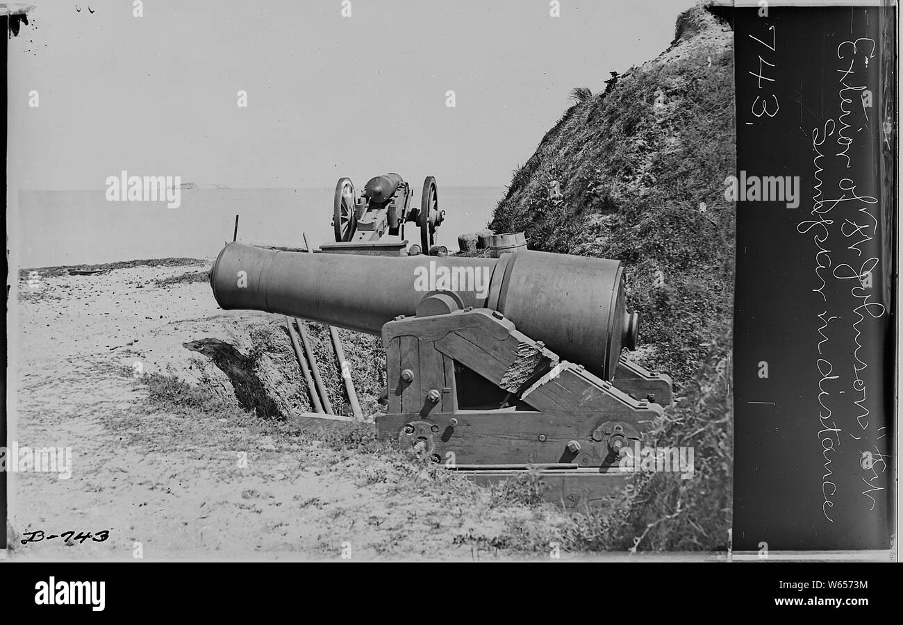 Exterior of Ft. Johnson, S.C., showing Ft. Sumter in the distance.; The foreground weapon is a ...