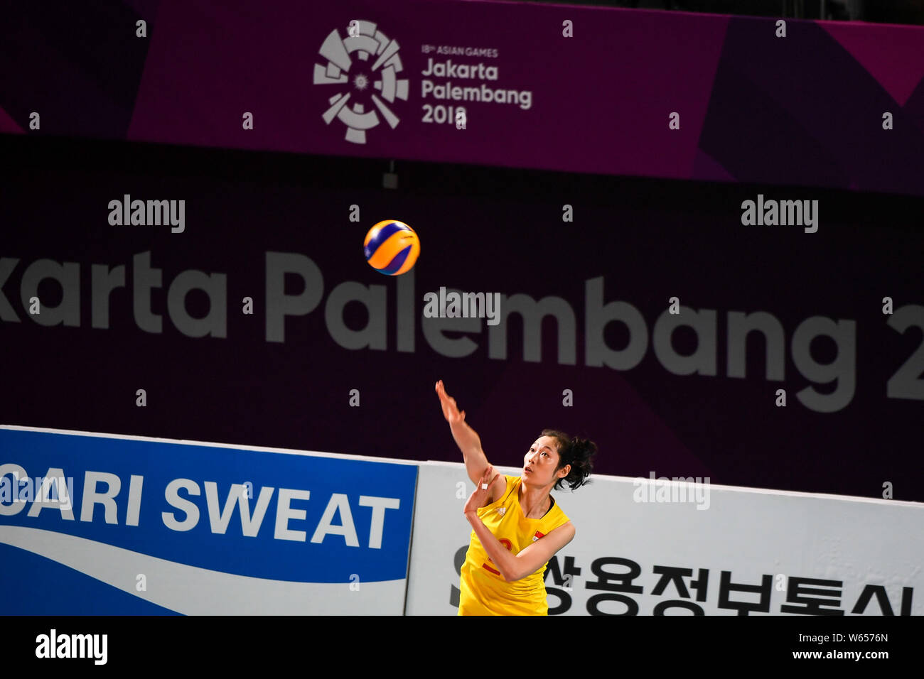 Yuan Xinyue of China serves against South Korea in the Women's ...