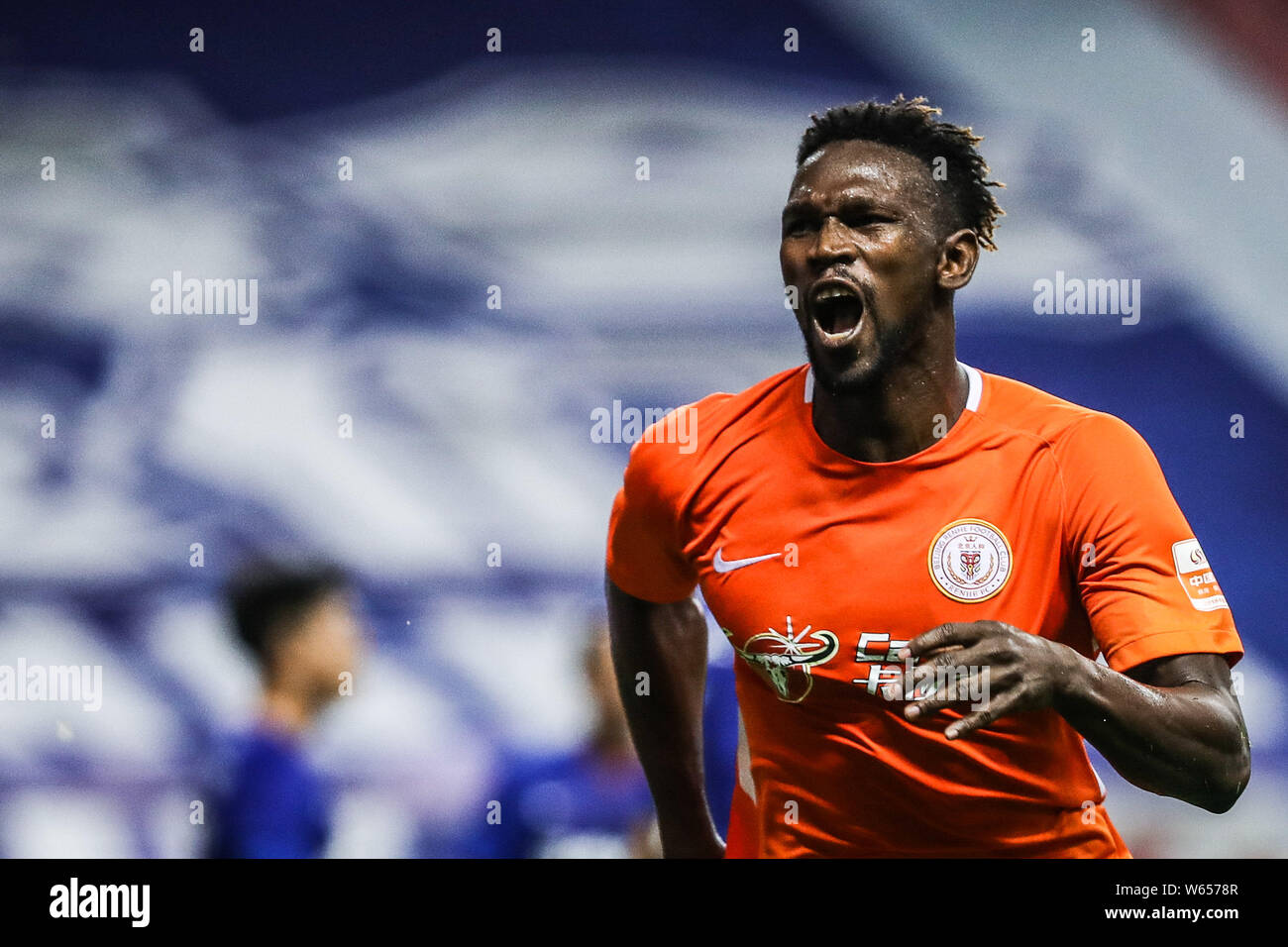 Senegalese football player Makhete Diop, right, of Beijing Renhe ...