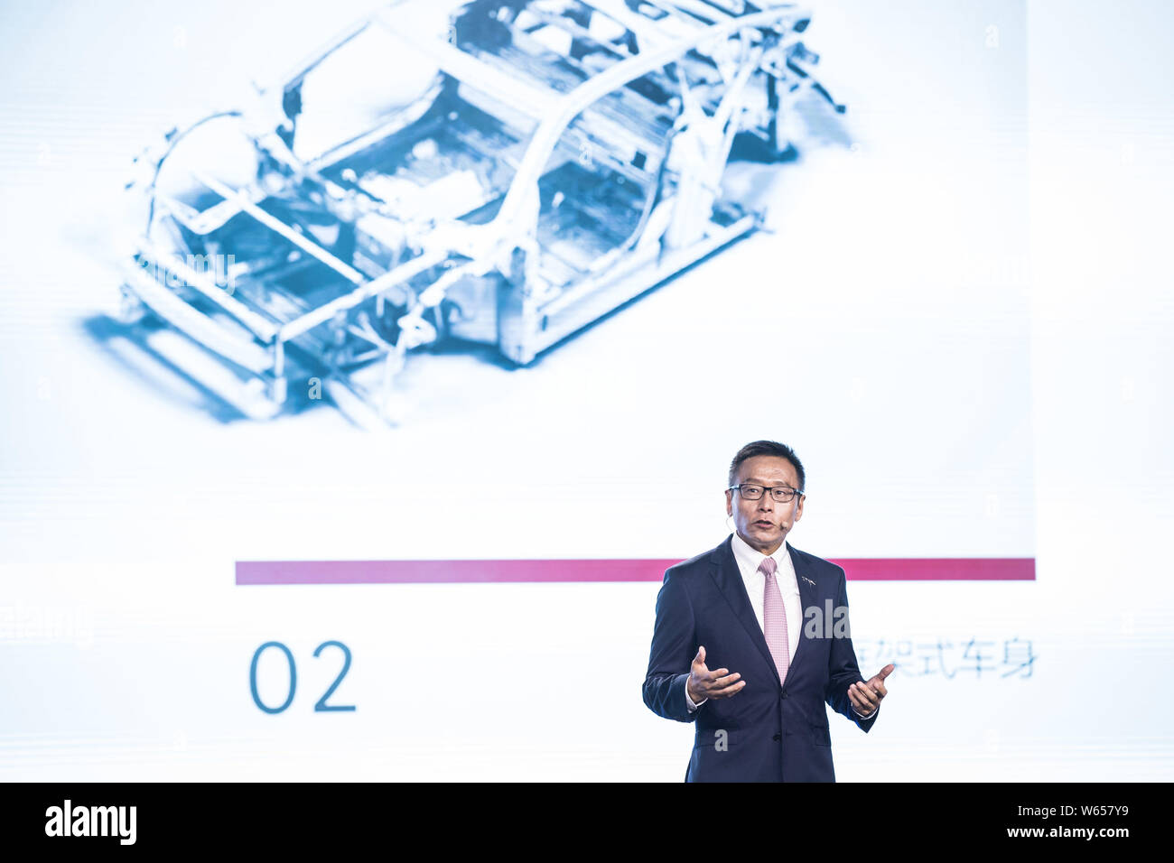 Lu Qun, Chairman of Qiantu Motor, delivers a speech during a launch ...