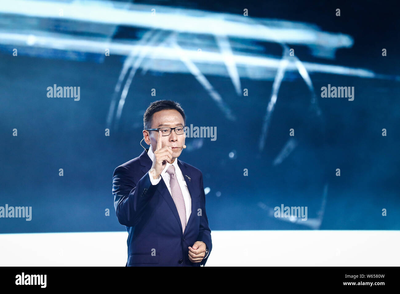 Lu Qun, Chairman of Qiantu Motor, delivers a speech during a launch ...