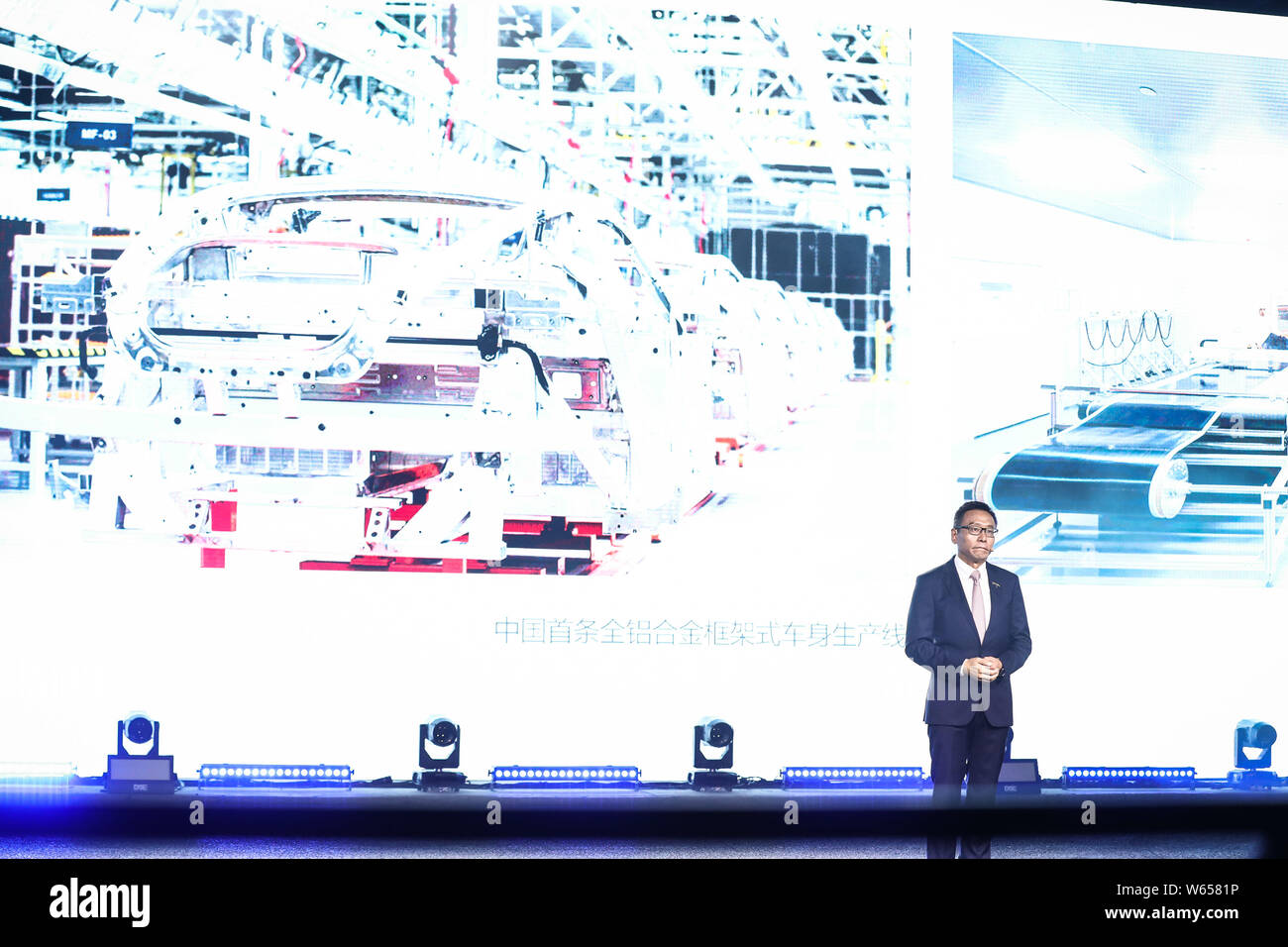 Lu Qun, Chairman of Qiantu Motor, delivers a speech during a launch ...