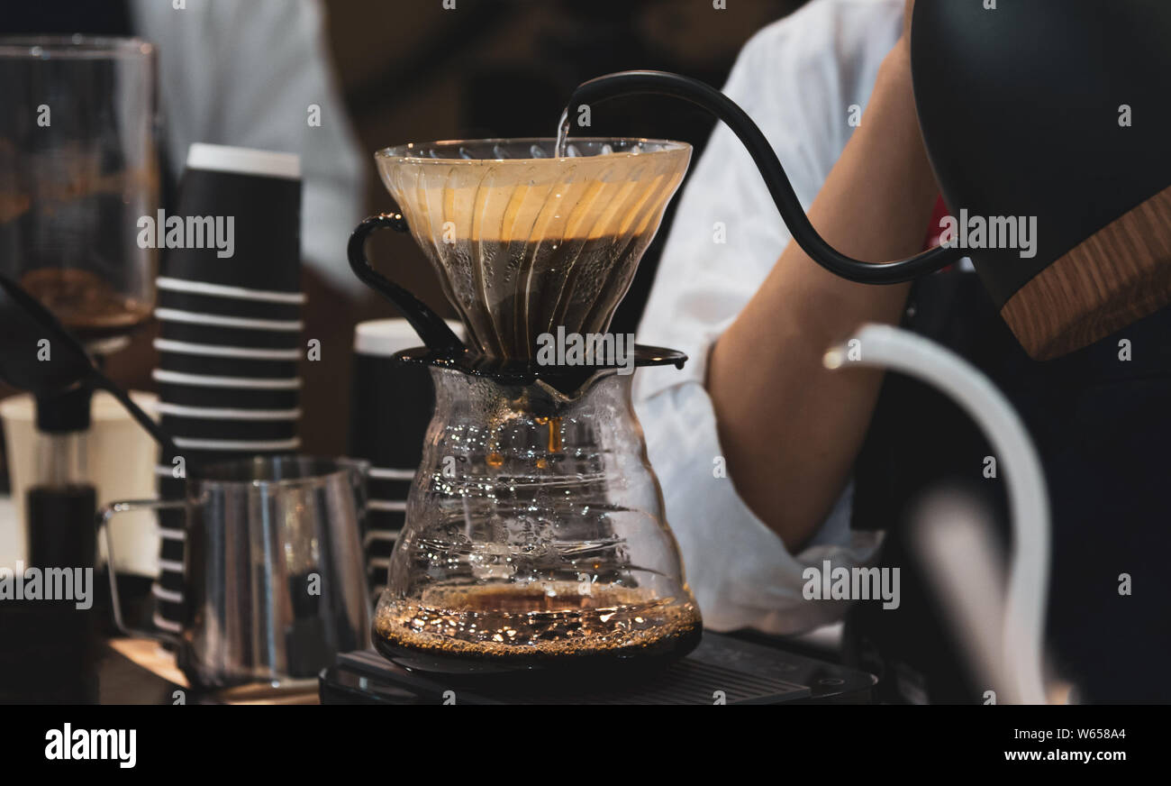 Barista making coffee, Barista pouring drip coffee into glass Stock ...