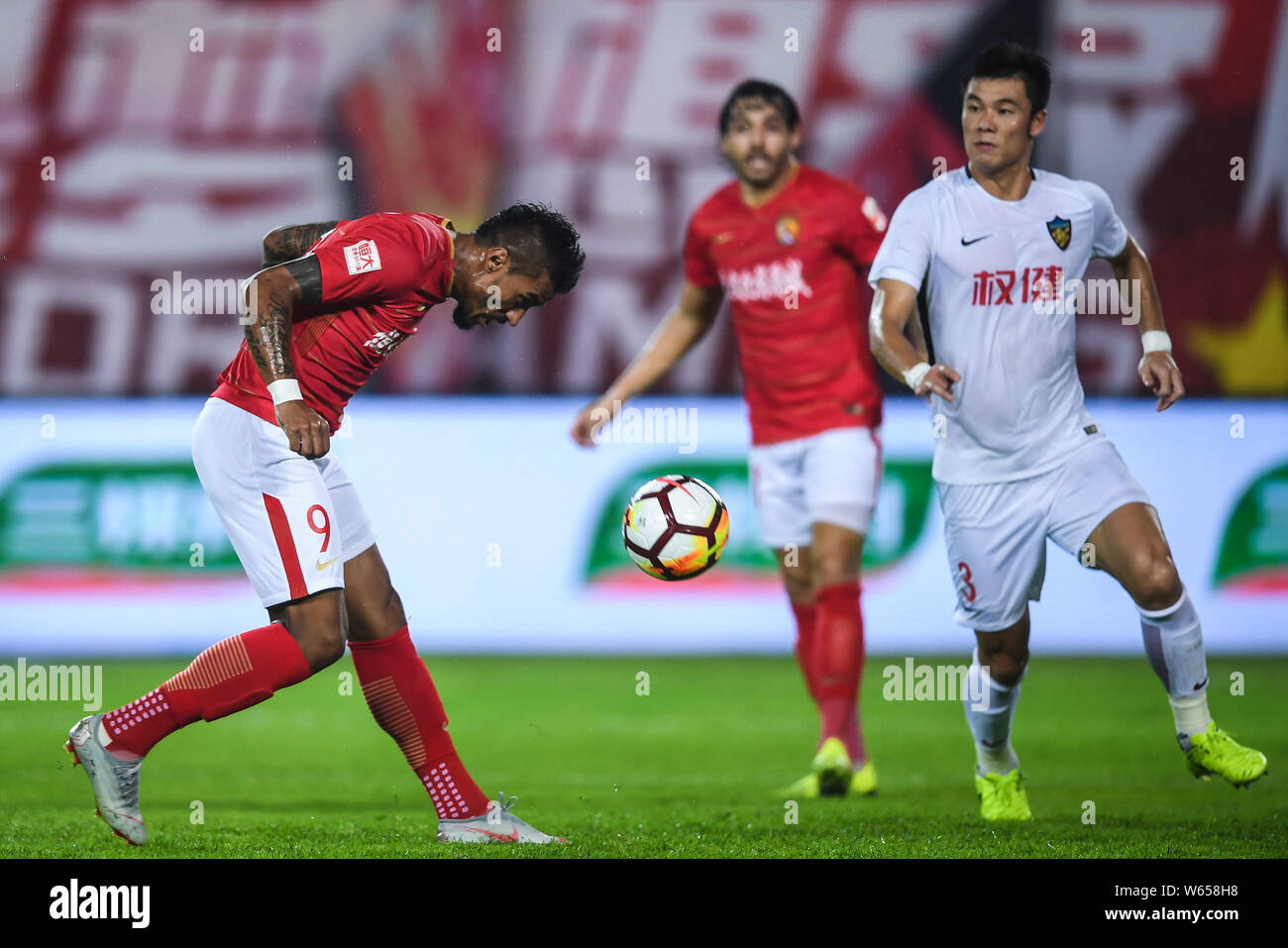 Brazilian football player Paulinho of Guangzhou Evergrande Taobao heads ...
