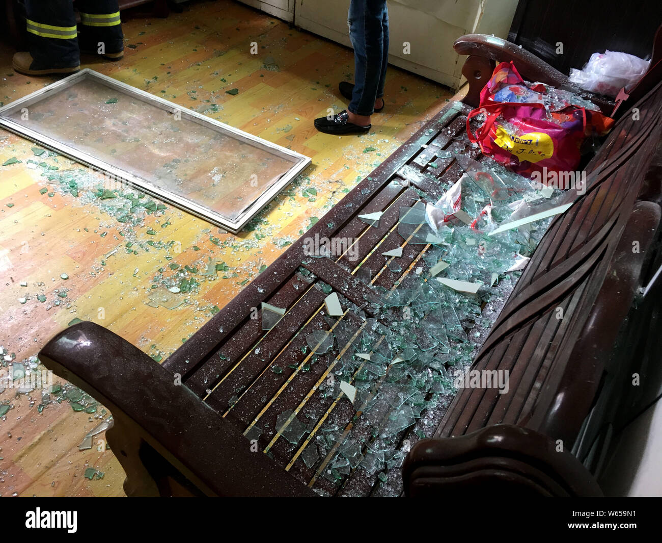 Cars are damaged after a liquefied gas container exploded, killing one ...