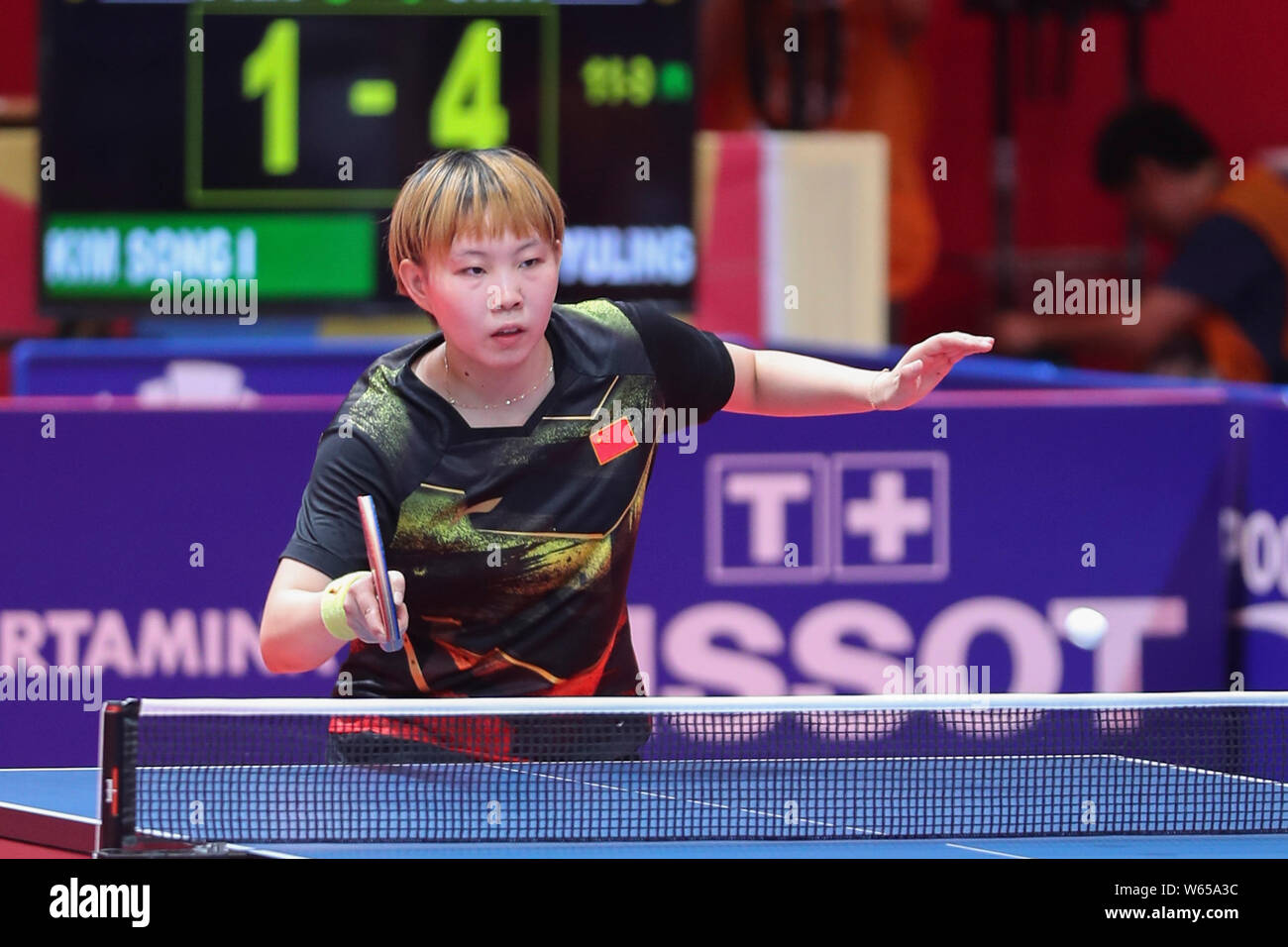 Zhu Yuling of China returns a shot to Kim Song-i of North Korea in the ...